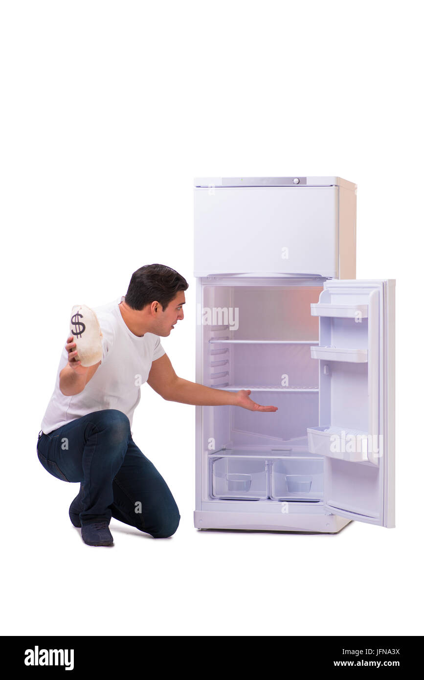 Hungry man looking for money to fill the fridge Stock Photo - Alamy