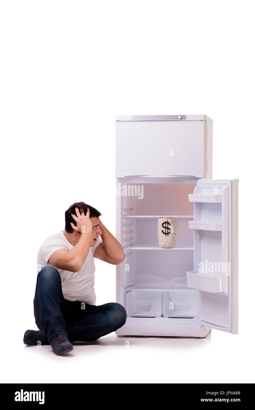 Hungry man looking for money to fill the fridge Stock Photo - Alamy
