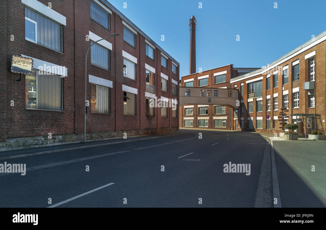Street through the factory Stock Photo - Alamy