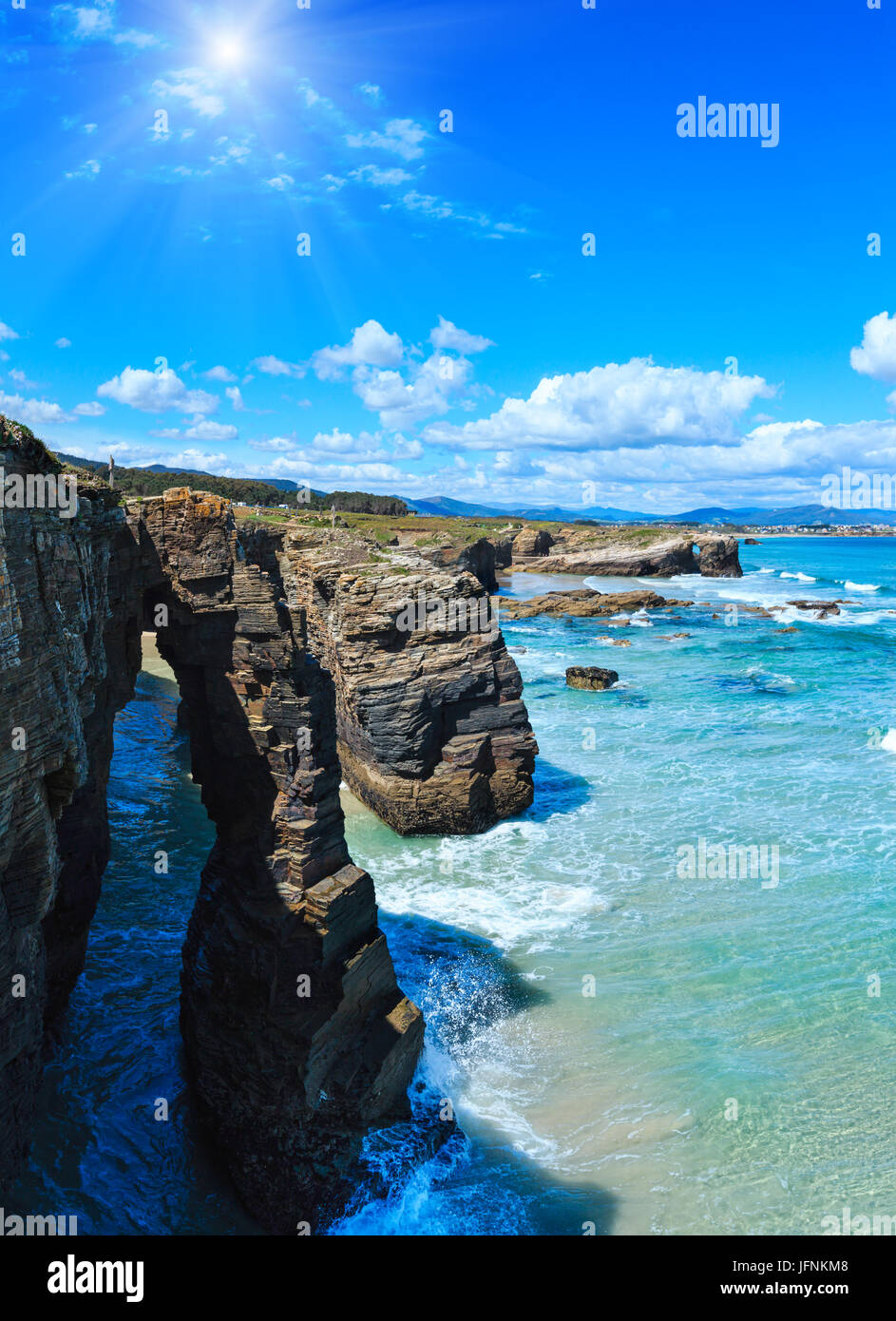 Natural arches on beach Stock Photo - Alamy