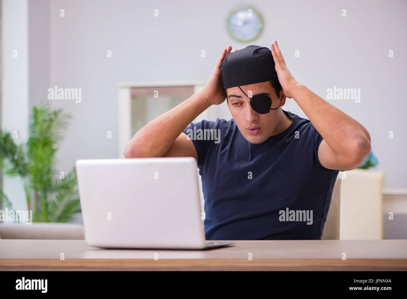 Digital security concept with pirate at computer Stock Photo - Alamy