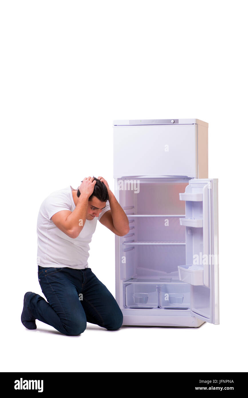 Hungry man opening empty fridge Cut Out Stock Images & Pictures - Alamy