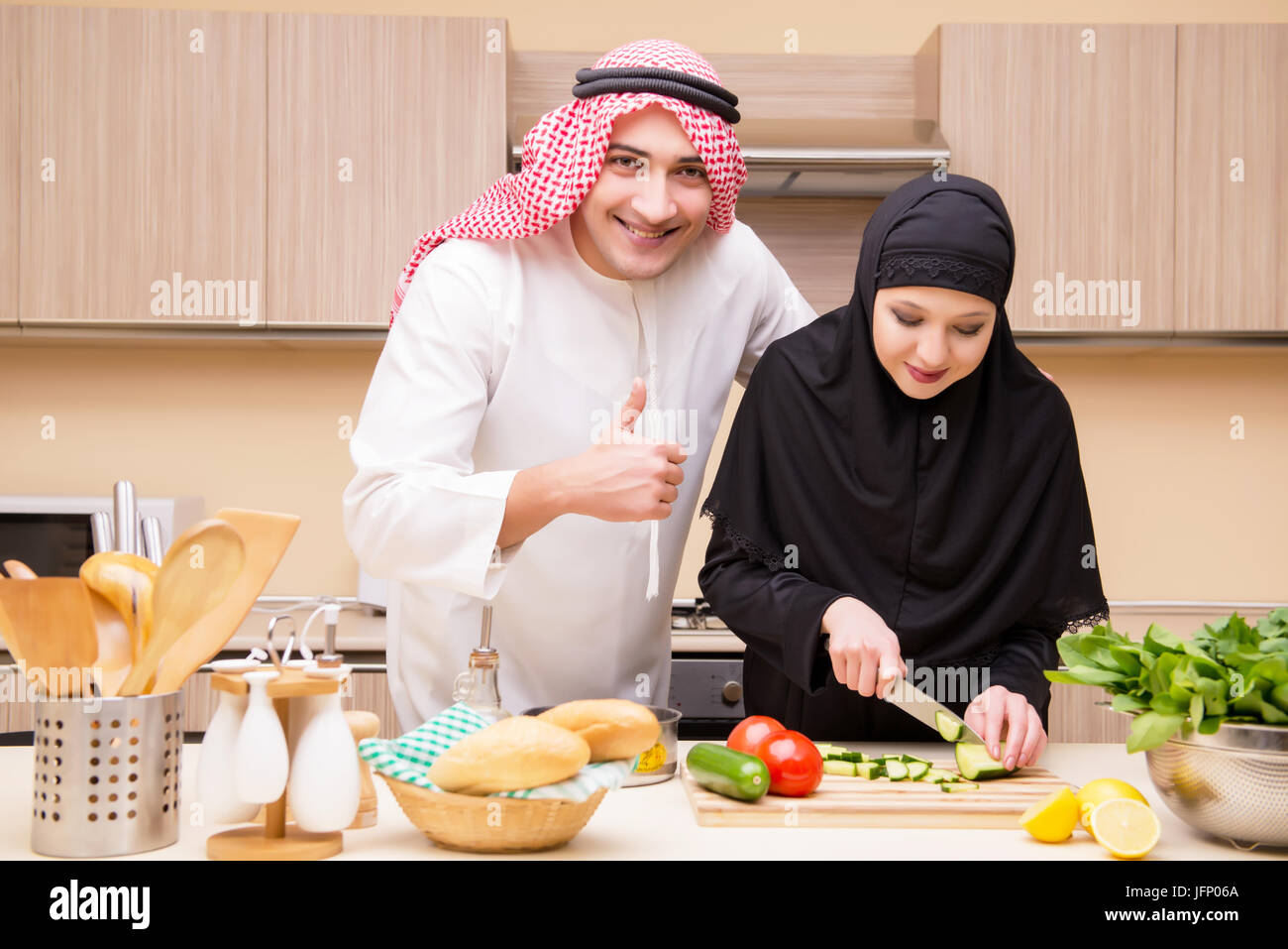 Young arab family in the kitchen Stock Photo - Alamy