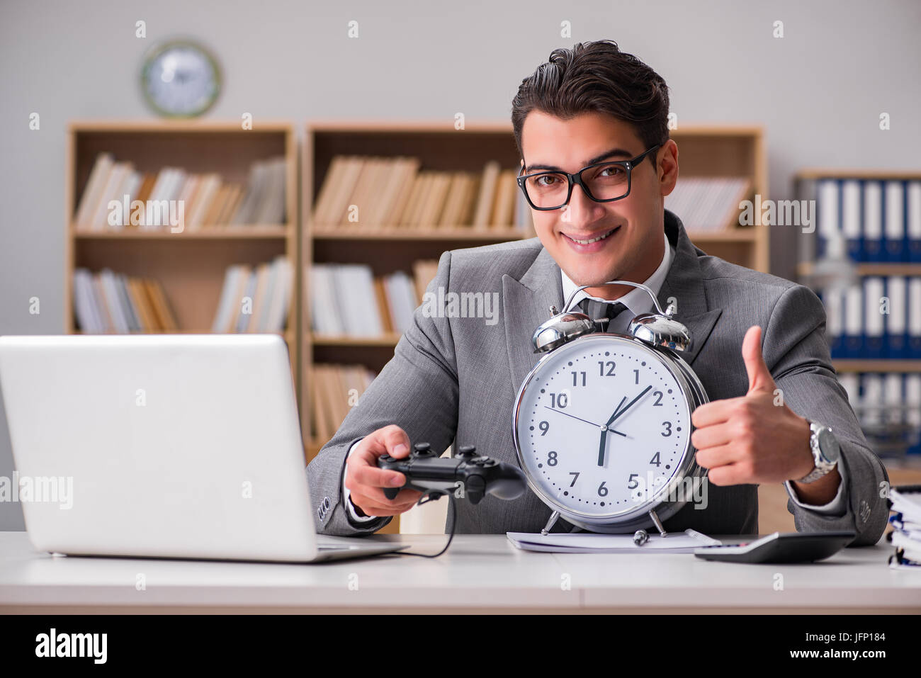 Businessman playing computer games at work office Stock Photo - Alamy
