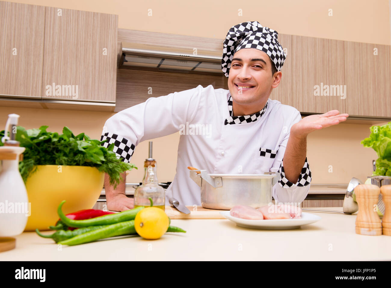 Young chef working in the kitchen Stock Photo - Alamy