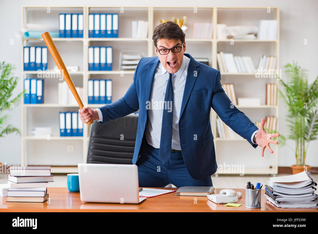 Angry aggressive businessman in the office Stock Photo - Alamy