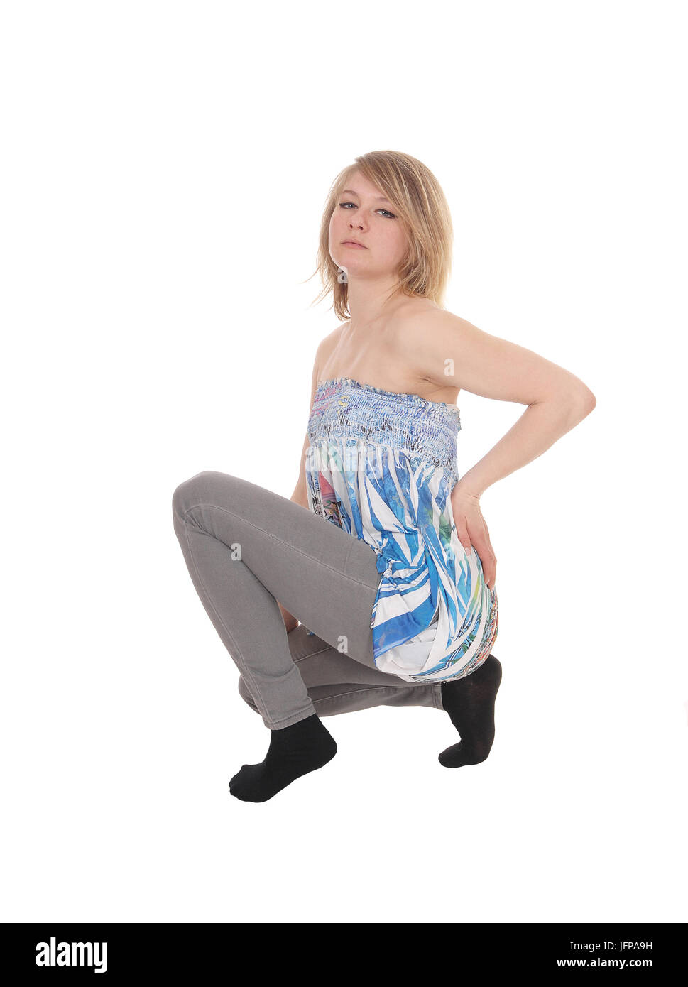 Woman crouching down isolated hi-res stock photography and images - Alamy