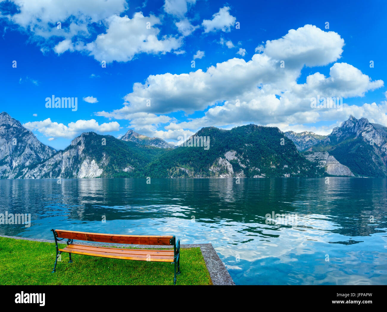 Banch near alpine summer lake Stock Photo - Alamy