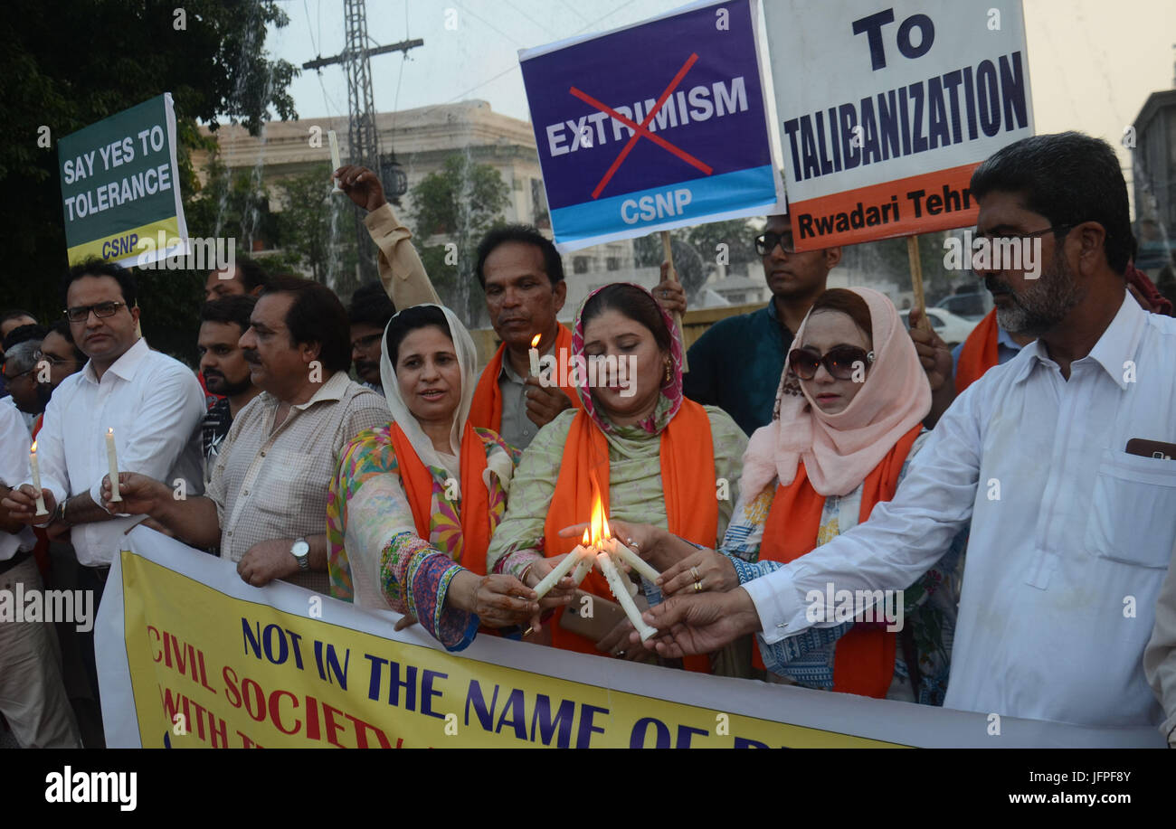 Pakistani civil society Network and Rawadari Tehreek activists hold a ...
