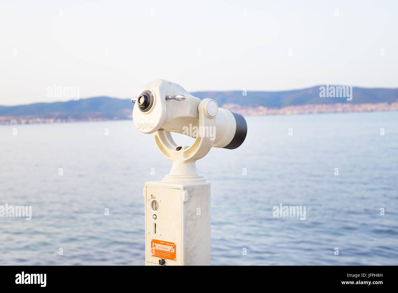 Telescope on the sea-summer, sun, sea beach Stock Photo - Alamy