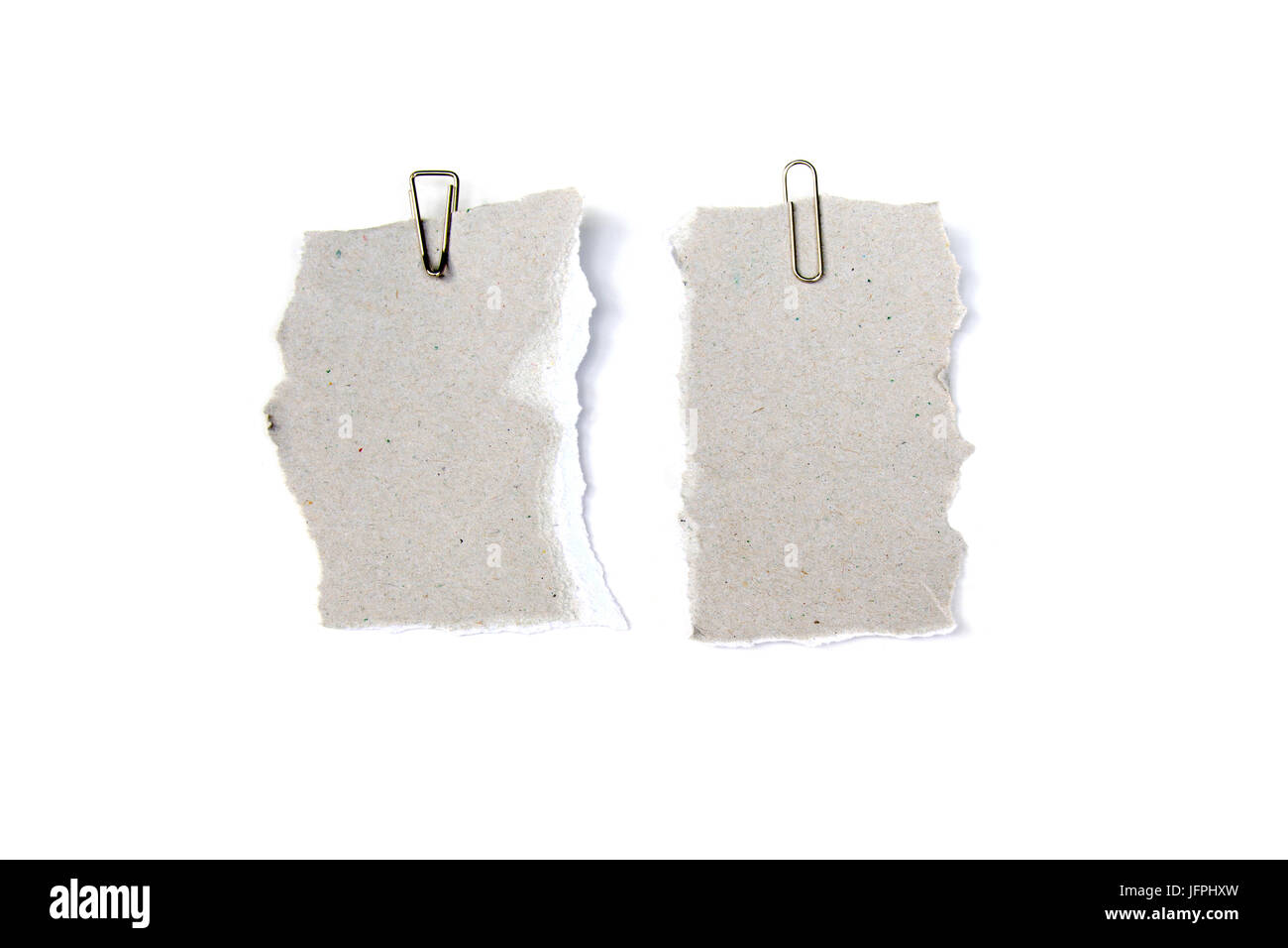 collection of white ripped pieces of paper with paper clip isolated on ...