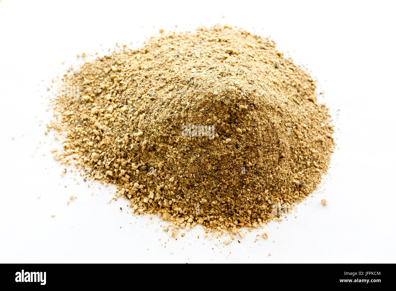 Brown pile of powder isolated on a white background. Milled boletus ...