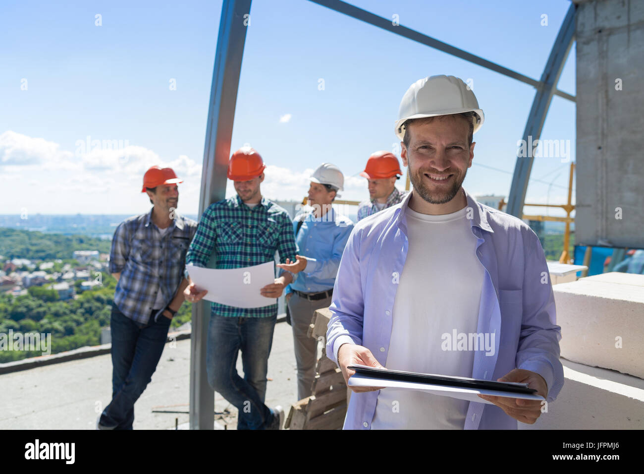 Team Of Builders On Site, Contractor Hold Plan Happy Smiling Over ...