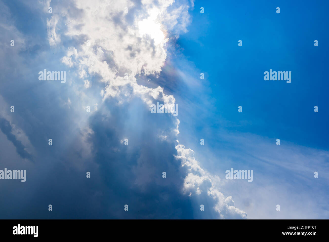 Sun rays through the clouds, Beautiful blue sky with clouds and rays of ...