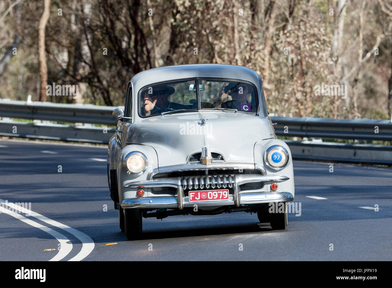 Vintage 1953 FJ Holden Utility (Ute) driving on country roads near the ...