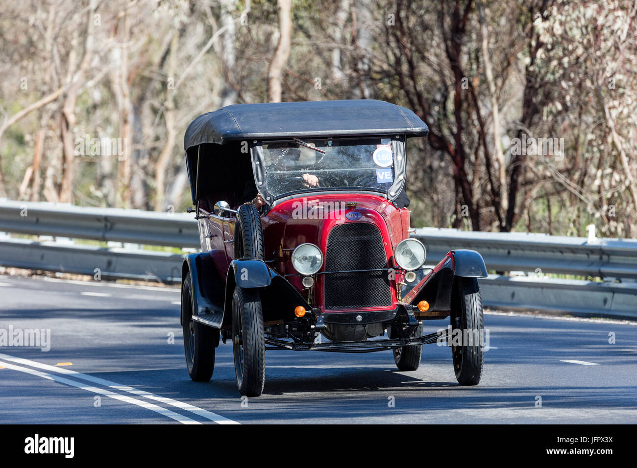 Vintage 1922 Fiat 501 Tourer driving on country roads near the town of ...