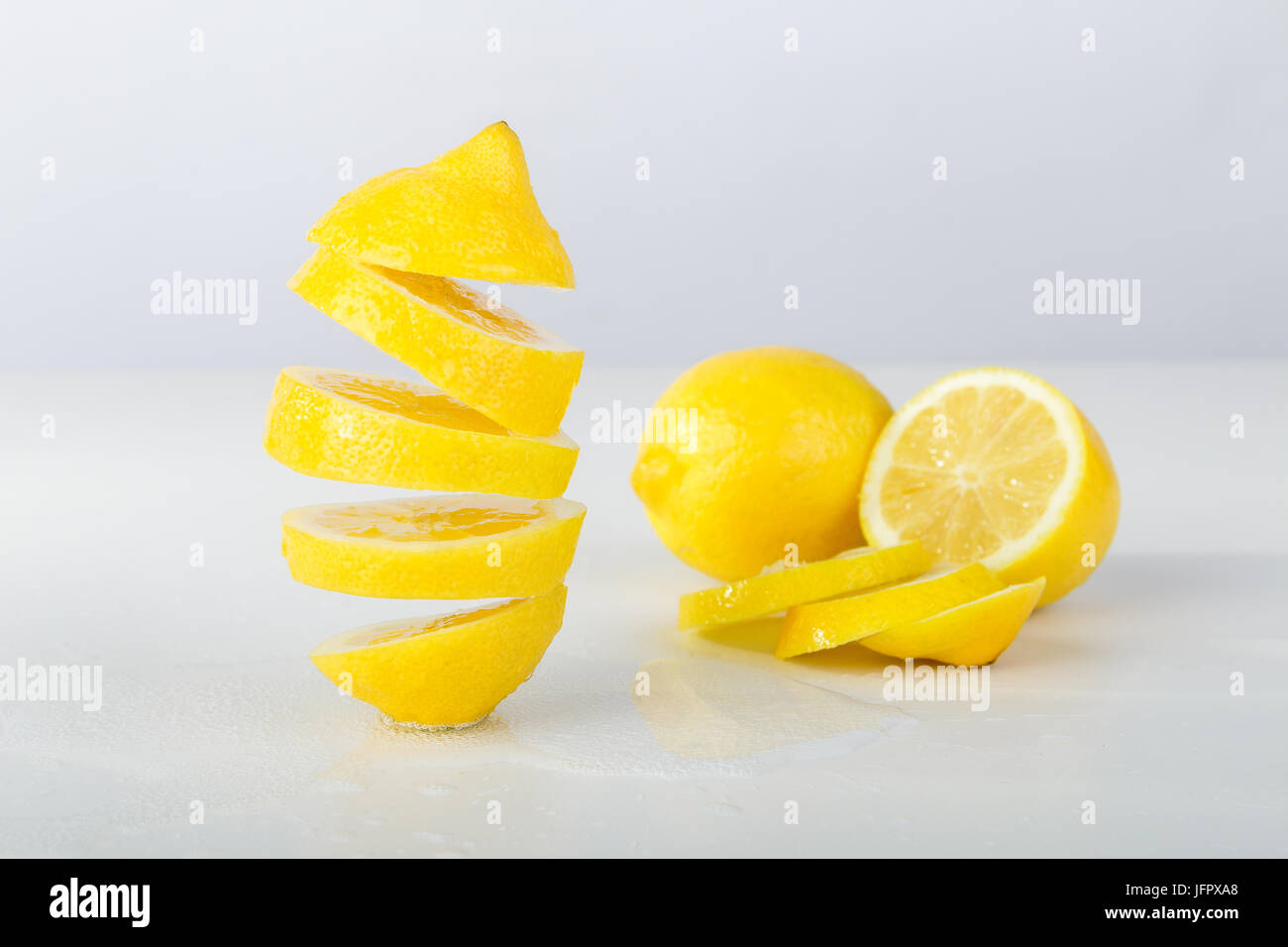 Flying lemon. Sliced lemon on white background. Levity fruit floating ...