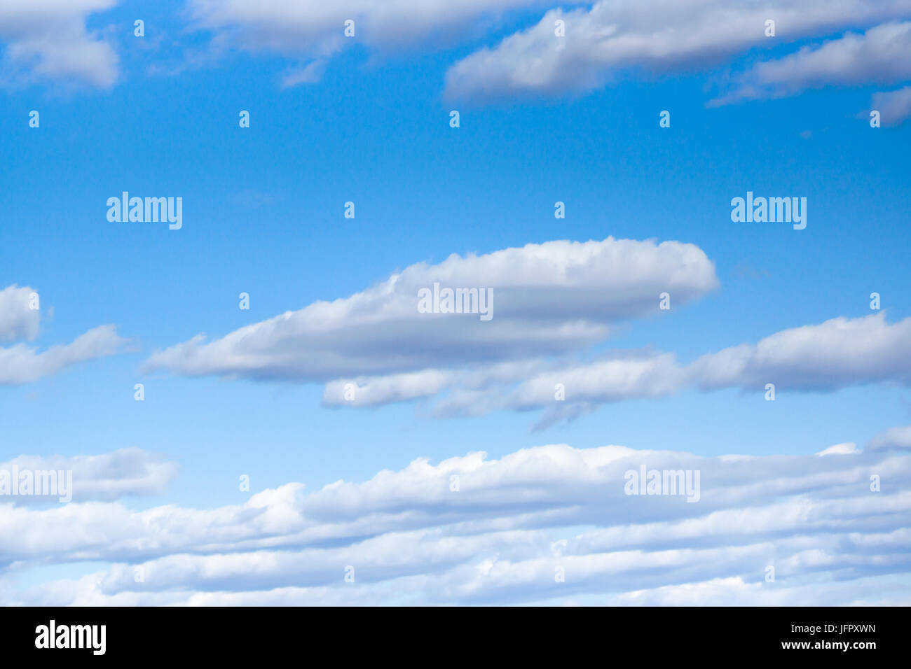 White cumulus clouds are on a blue sky Stock Photo - Alamy