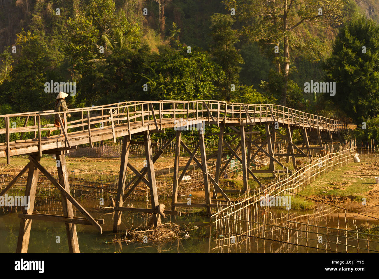 Simple wooden bridge made to cross the river Stock Photo - Alamy