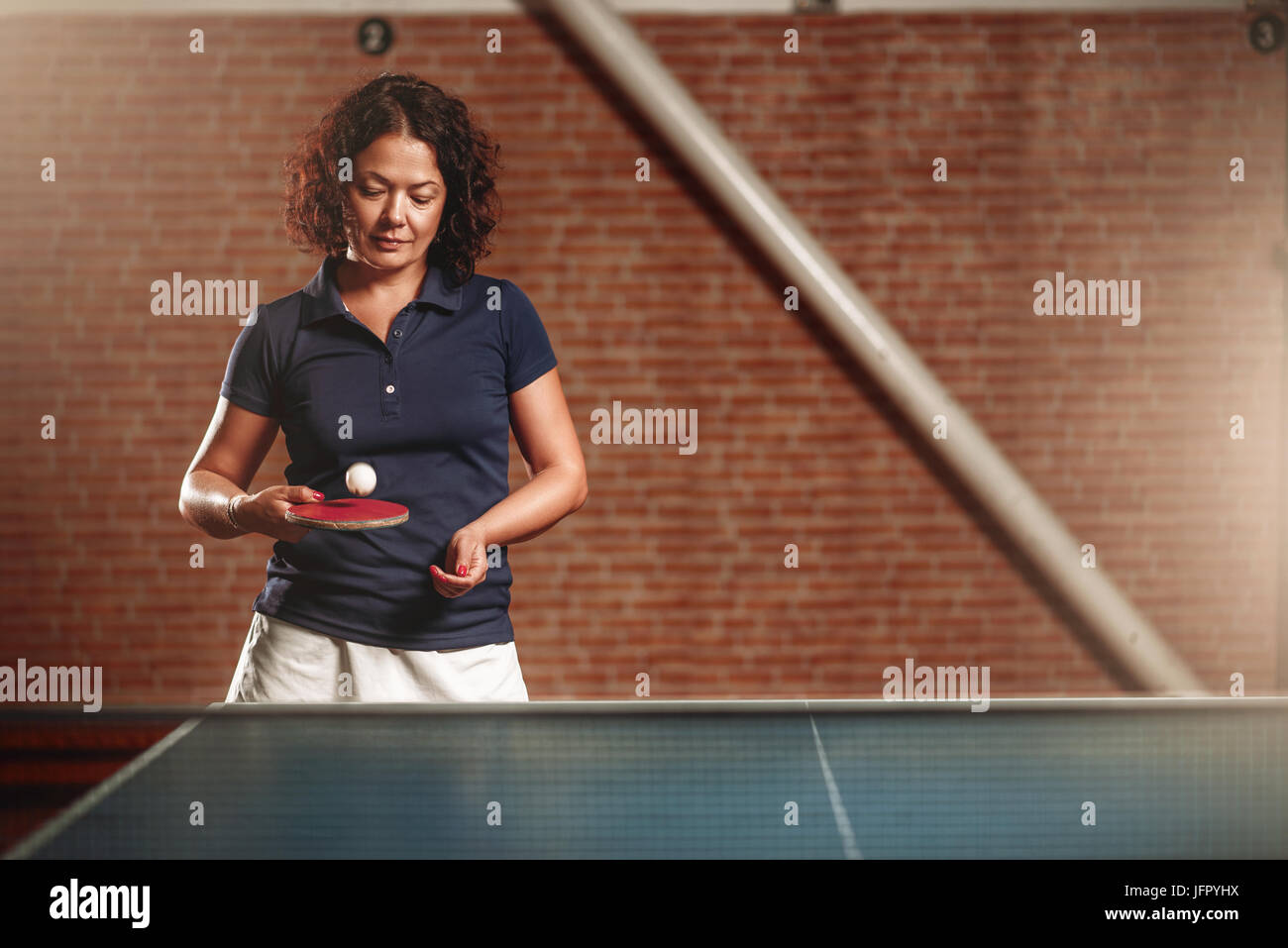 Table tennis, female player with racket hits ball. Ping pong training ...