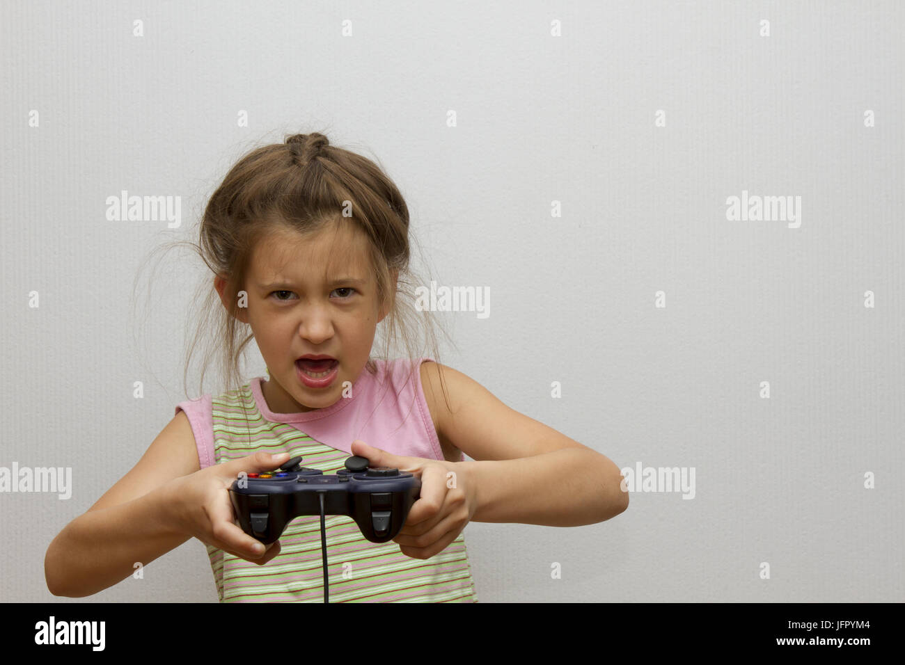 children little girl holding joystick happy play video game Stock Photo ...