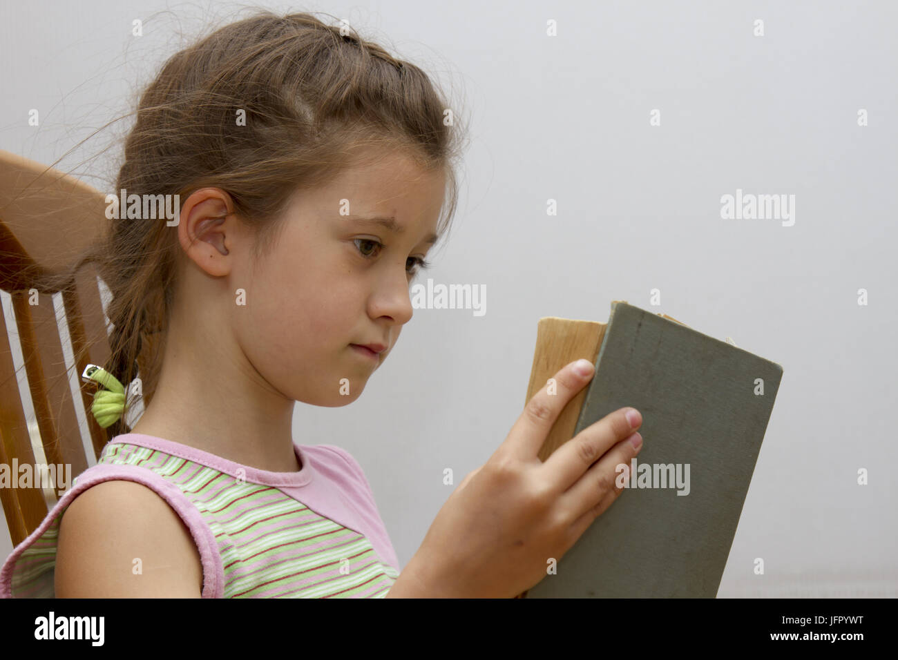 little girl reading big book Stock Photo - Alamy
