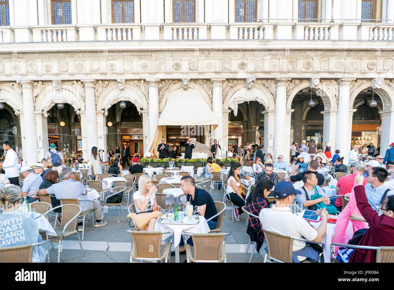 Venice, Veneto / Italy. May 21, 2017: Terraces with drinking people and ...