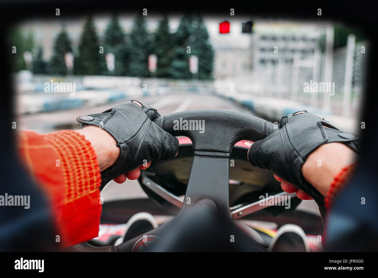 Karting driver on start line, view through the eyes of the racer. Go ...