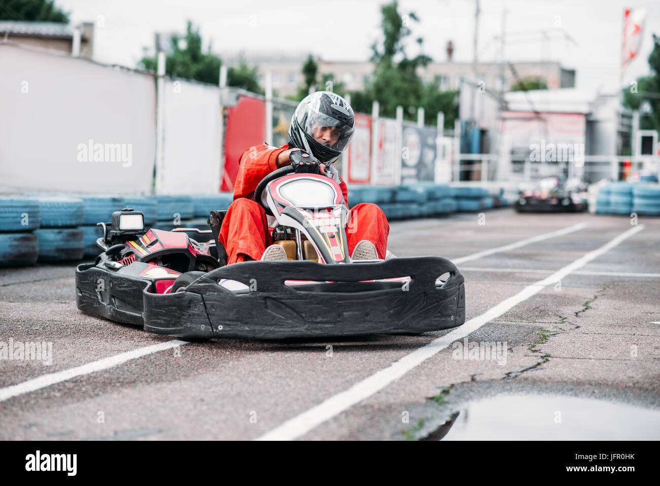 Karting racer in action, go kart competition on outdoor track. Carting ...
