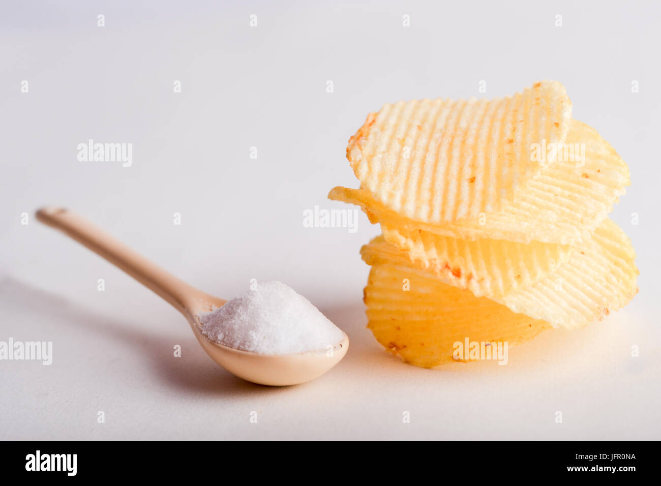 Potato Chips arranged with salt Stock Photo - Alamy
