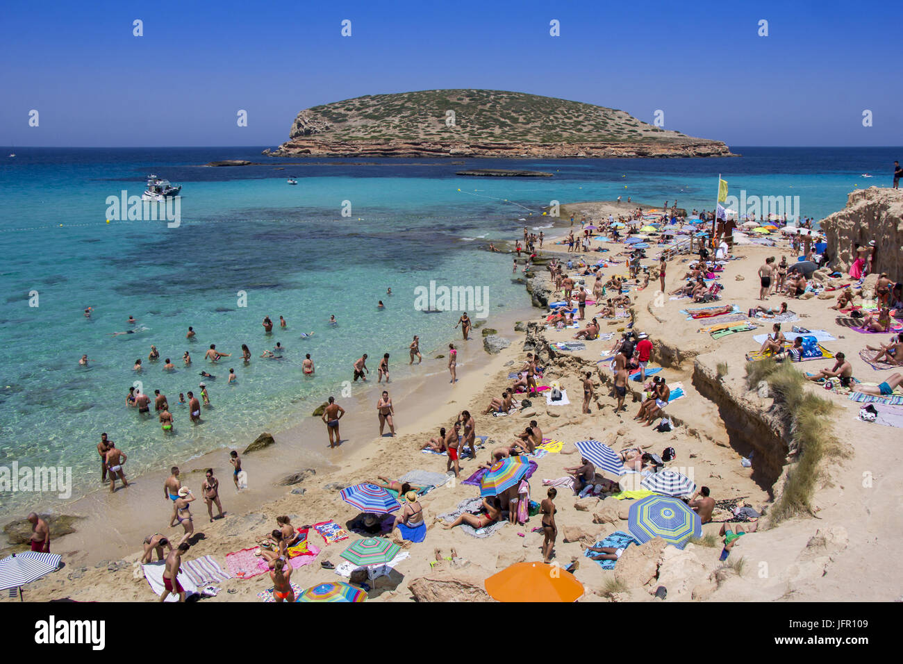 IBIZA, SPAIN - JUNE 26: Many tourists at Cala Conta beach on June 26 ...