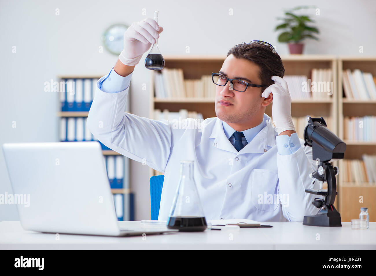Chemical engineer working on oil samples in lab Stock Photo - Alamy