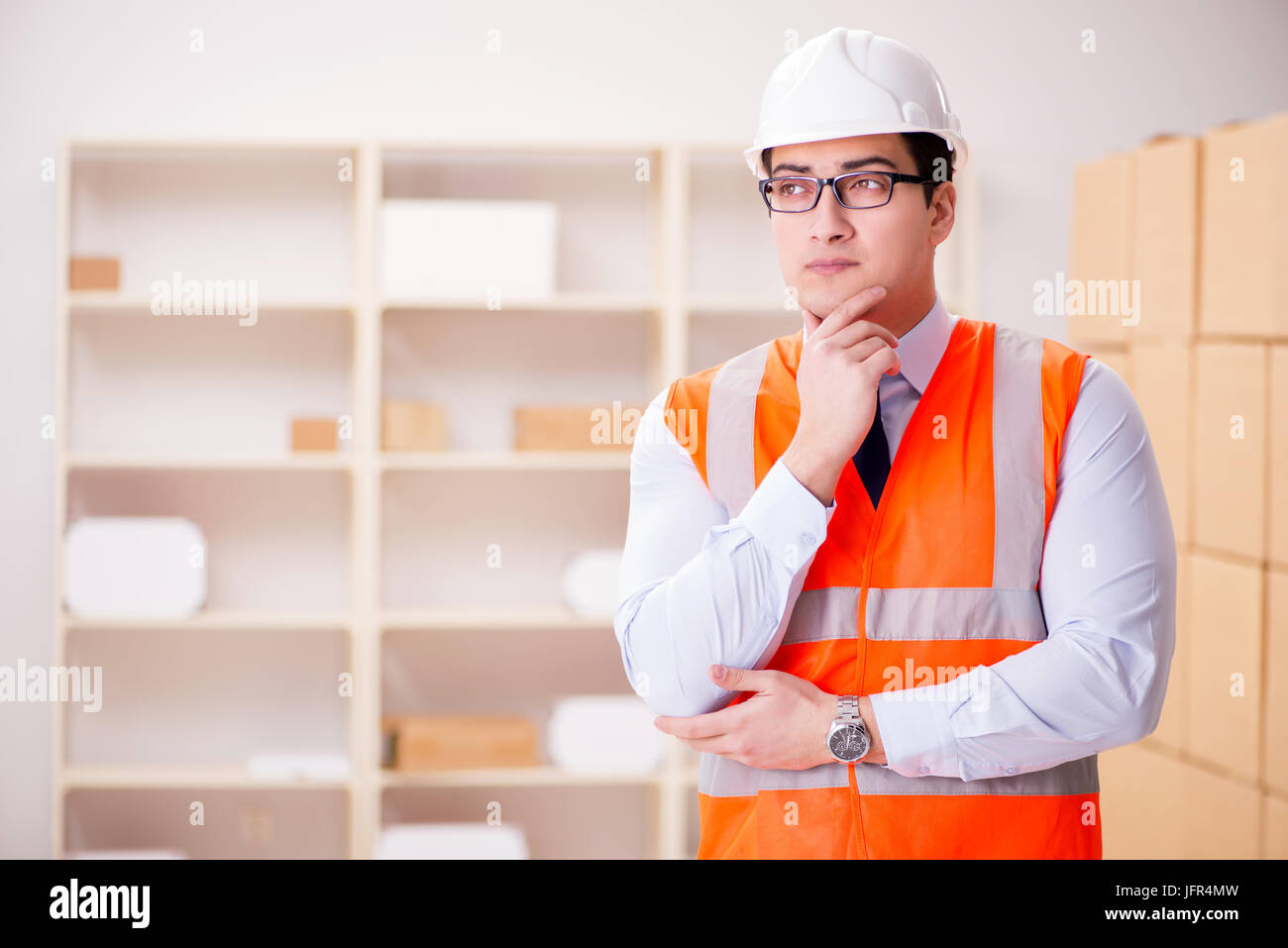 Man working in postal parcel delivery service office Stock Photo - Alamy