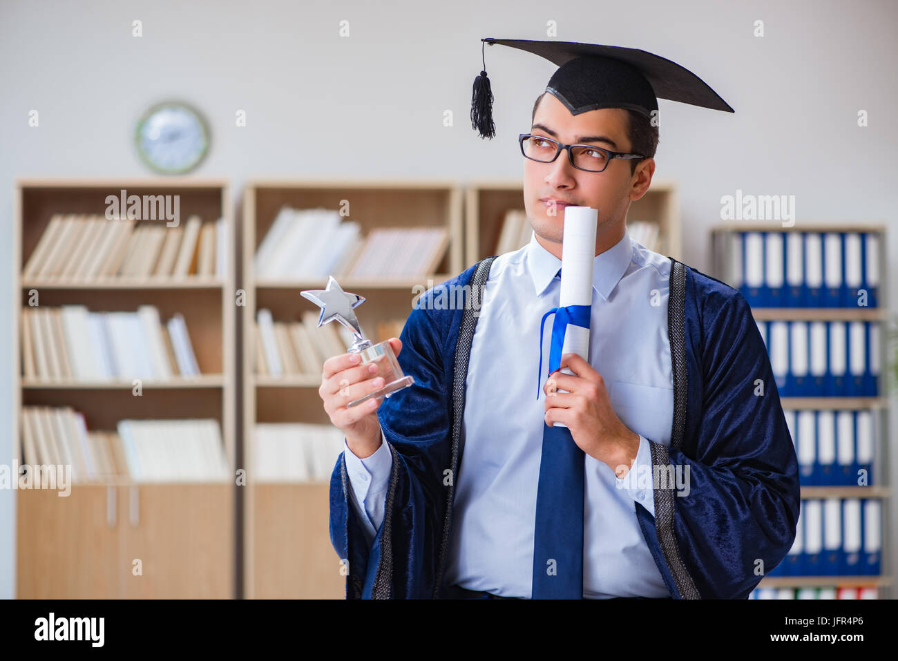 Young man graduating from university Stock Photo - Alamy