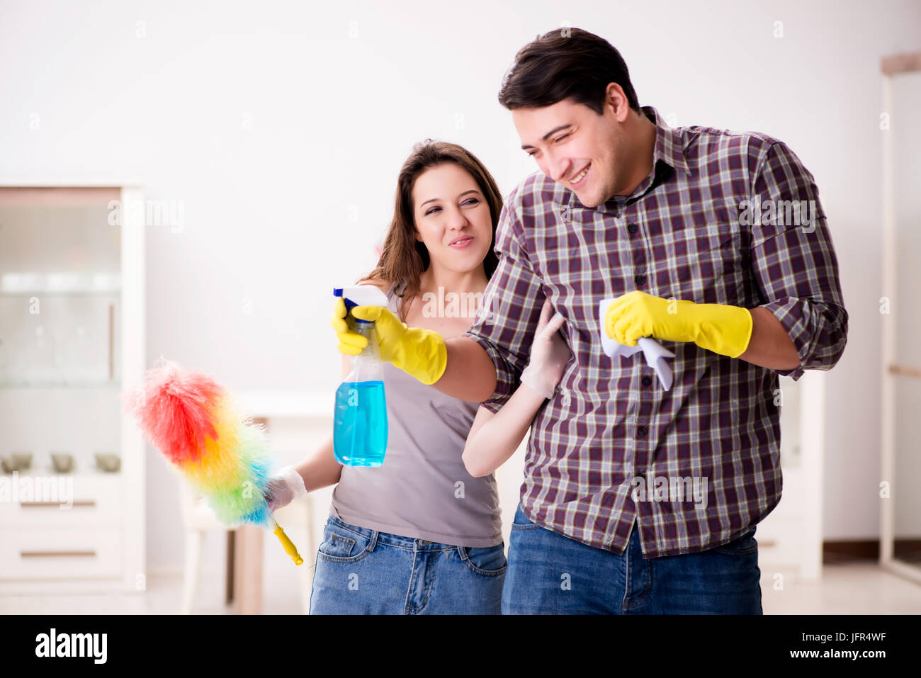 Wife and husband doing cleaning at home Stock Photo - Alamy
