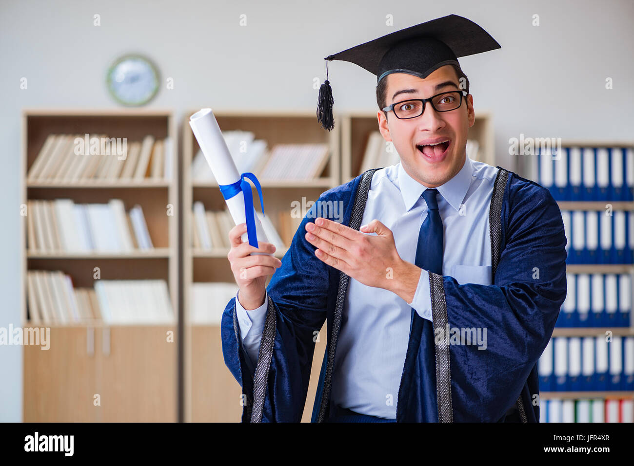 Young man graduating from university Stock Photo - Alamy