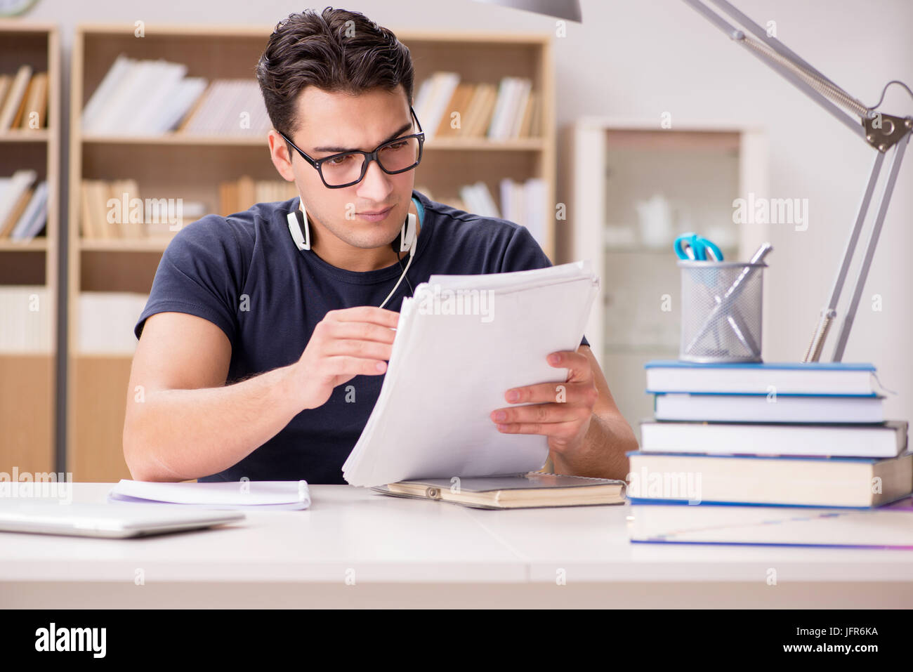 The happy male student preparing for his exams Stock Photo - Alamy