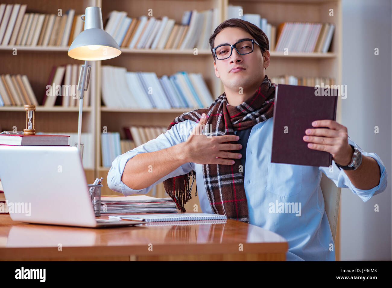 The young book writer writing in library Stock Photo - Alamy