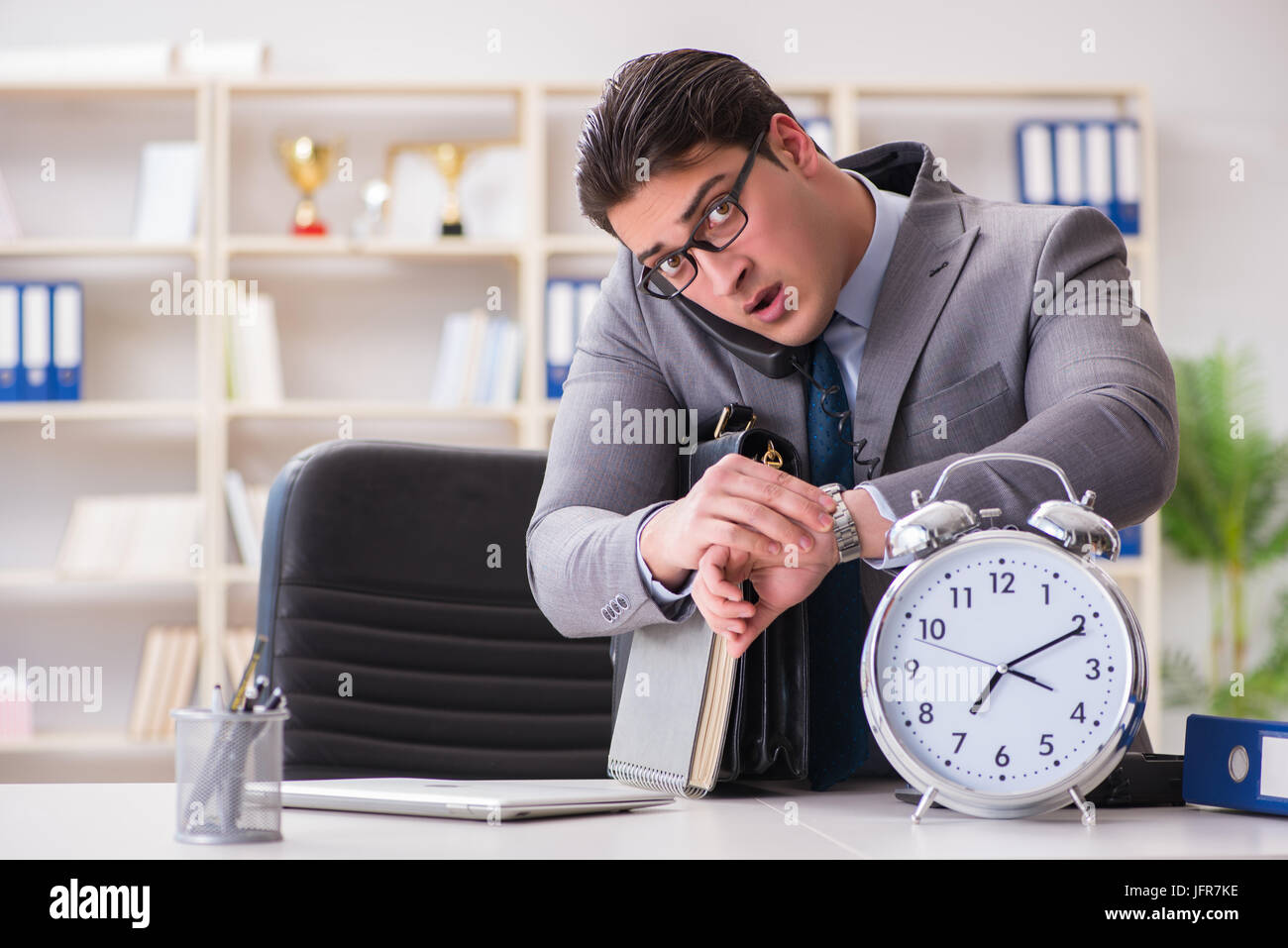 The businessman rushing in the office Stock Photo - Alamy