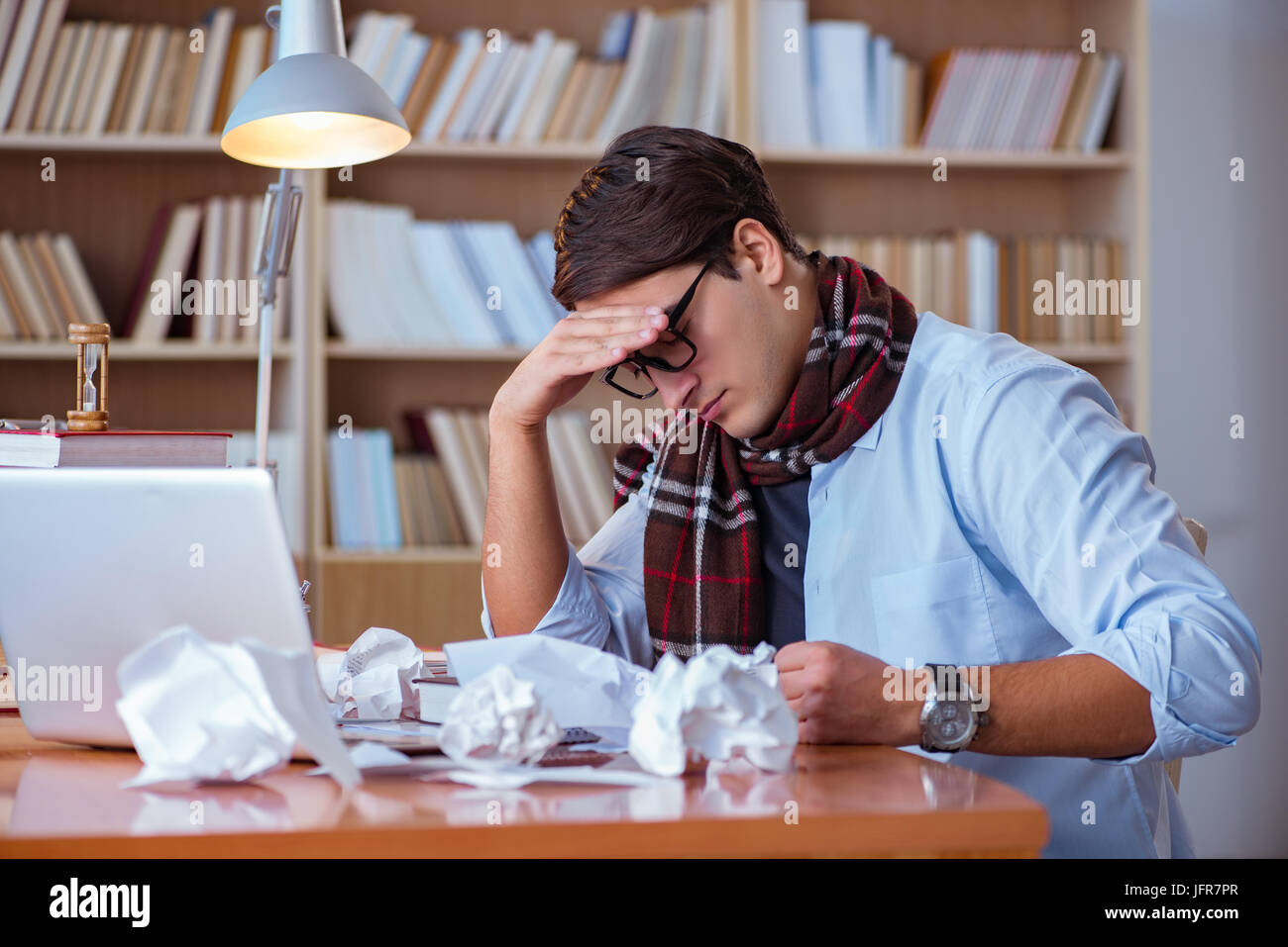 The young book writer writing in library Stock Photo - Alamy