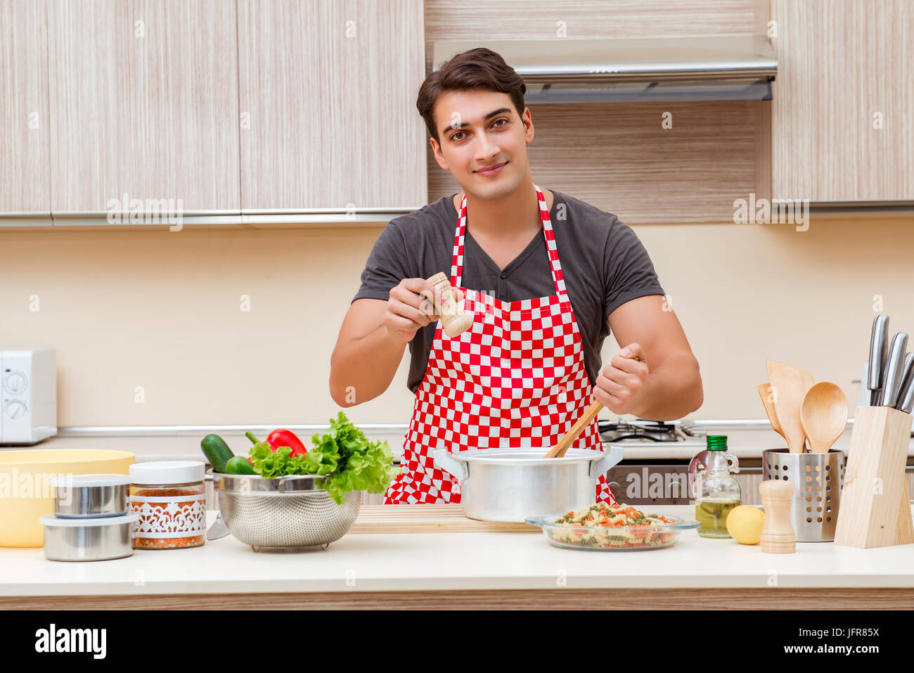 The man male cook preparing food in kitchen Stock Photo - Alamy