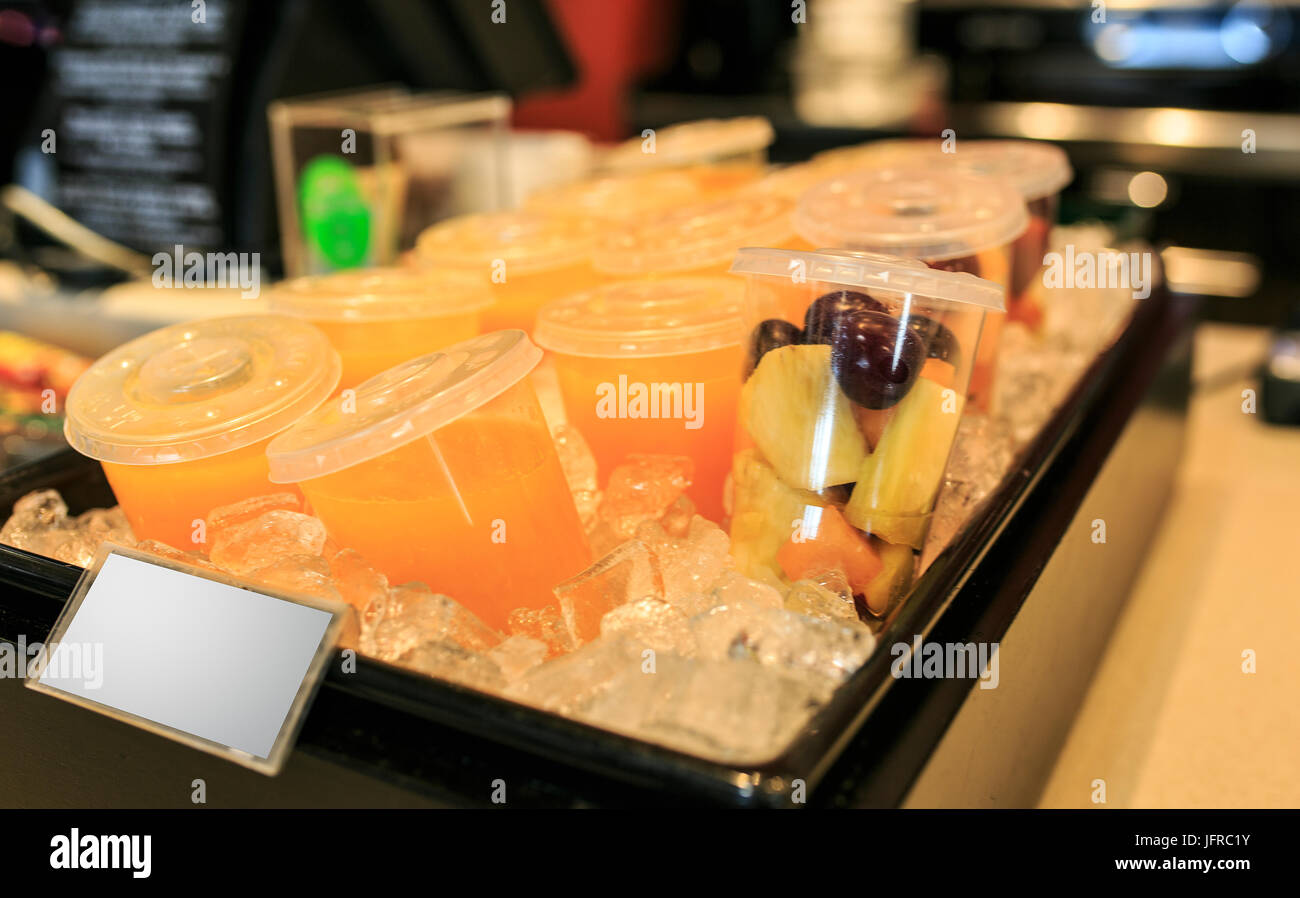 Natural orange juice in ice Stock Photo - Alamy