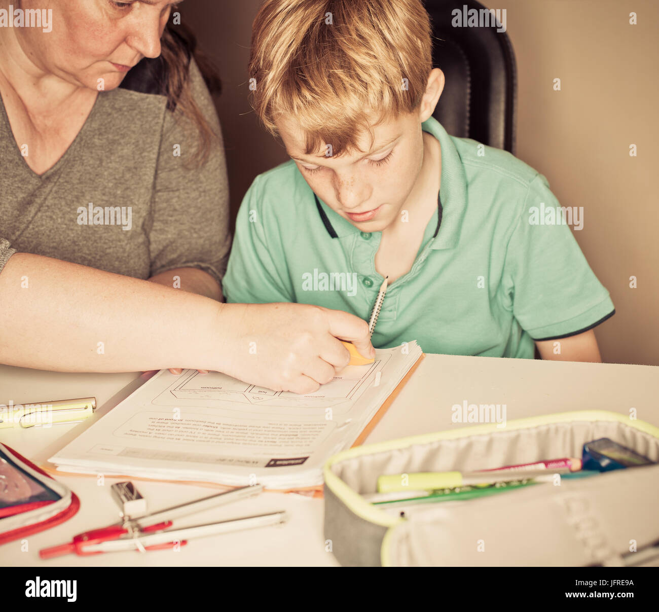 Child gets tutoring lessons in Old School Design Stock Photo - Alamy