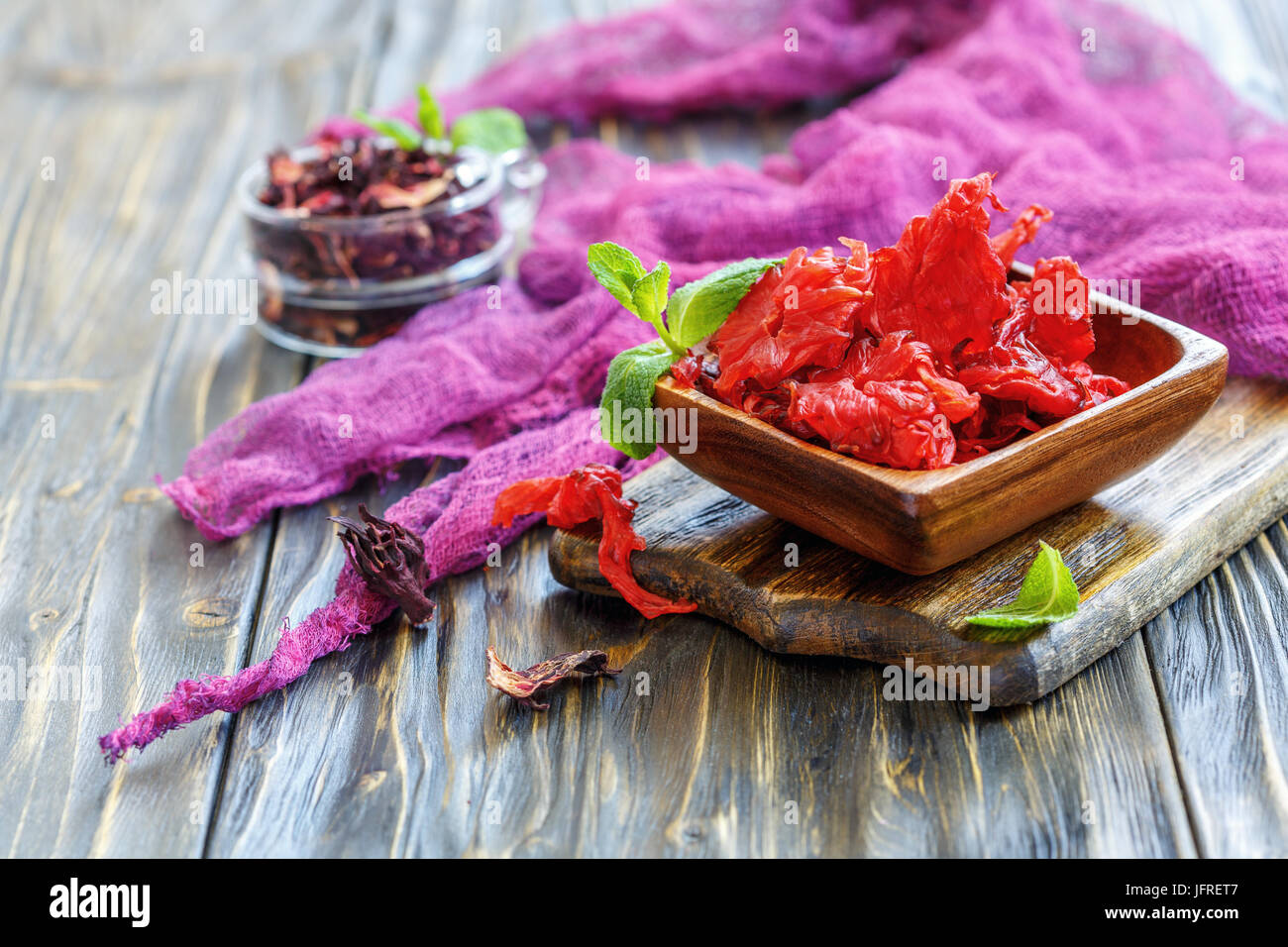 Candied hibiscus in a wooden bowl Stock Photo - Alamy