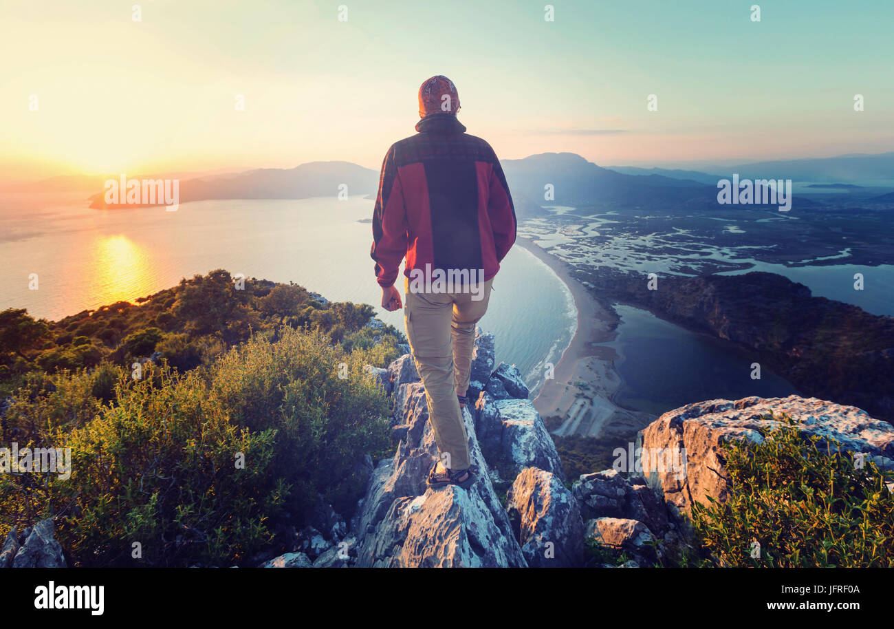 Man on the cliff Stock Photo - Alamy