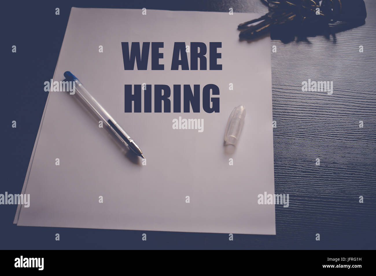 we are hiring written on white paper on desk at office Stock Photo - Alamy