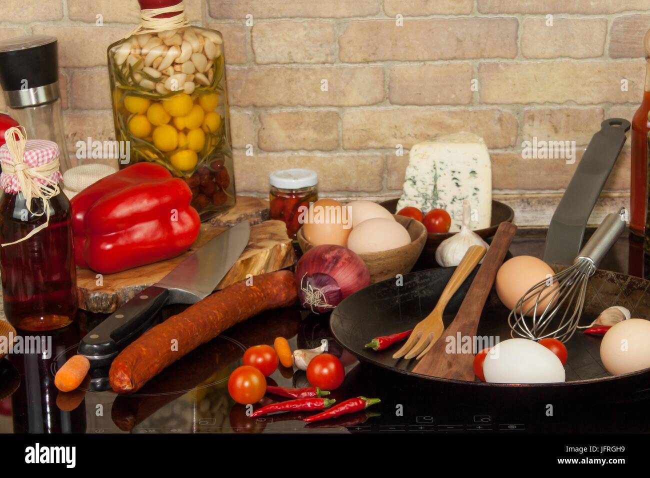 Steel frying pan on the stove. Kitchen utensils. Preparation of egg ...