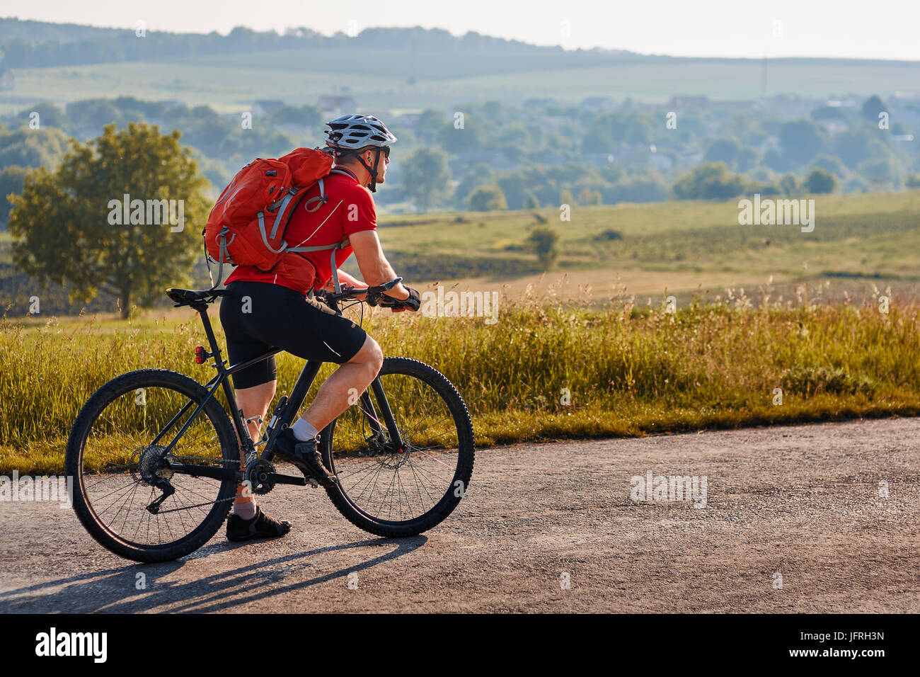 Ecotourism in Europe. Bicycle race in the country. Bicyclist traveler ...