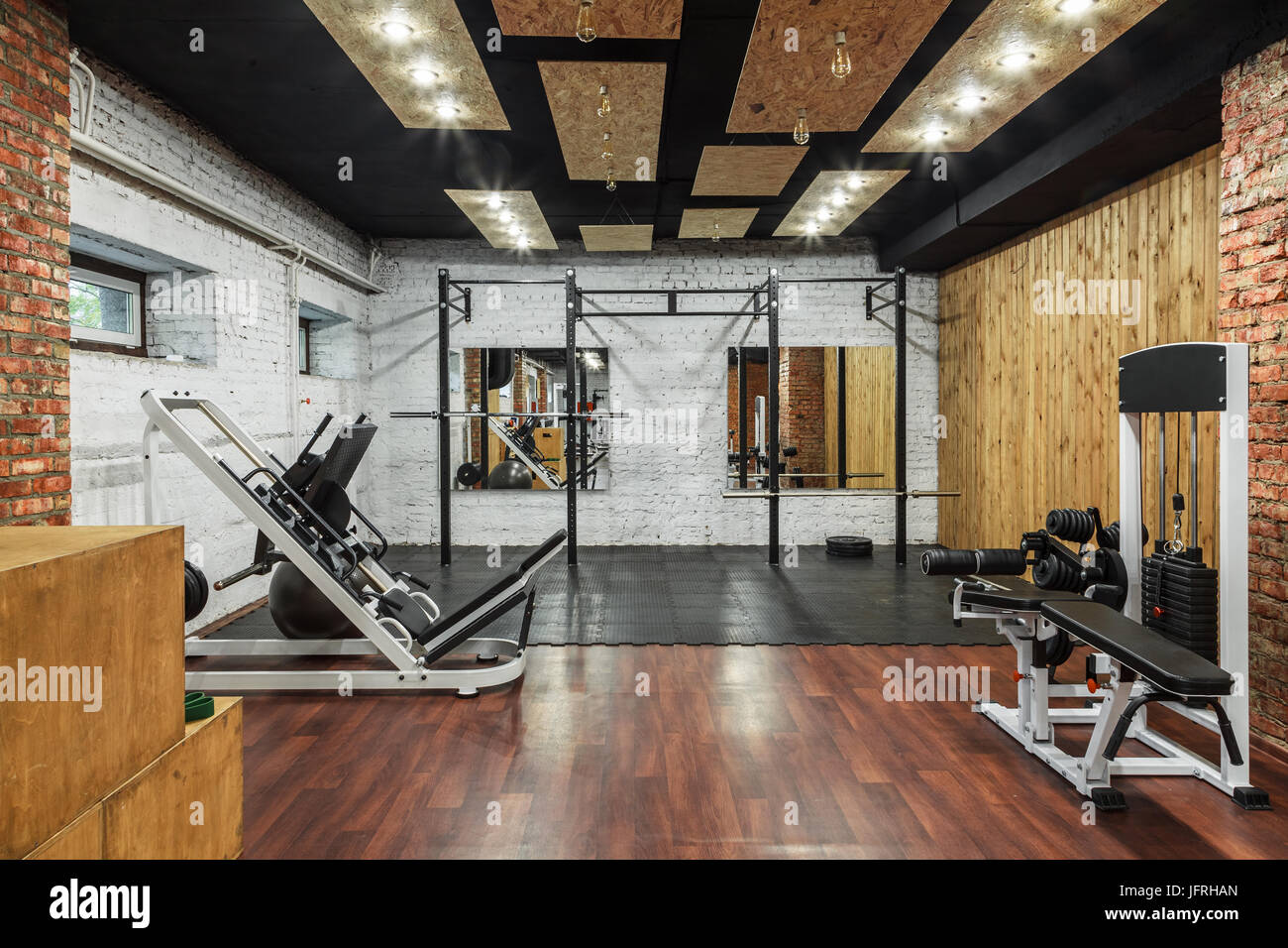 Interior of a gym with equipment at underground style Stock Photo - Alamy