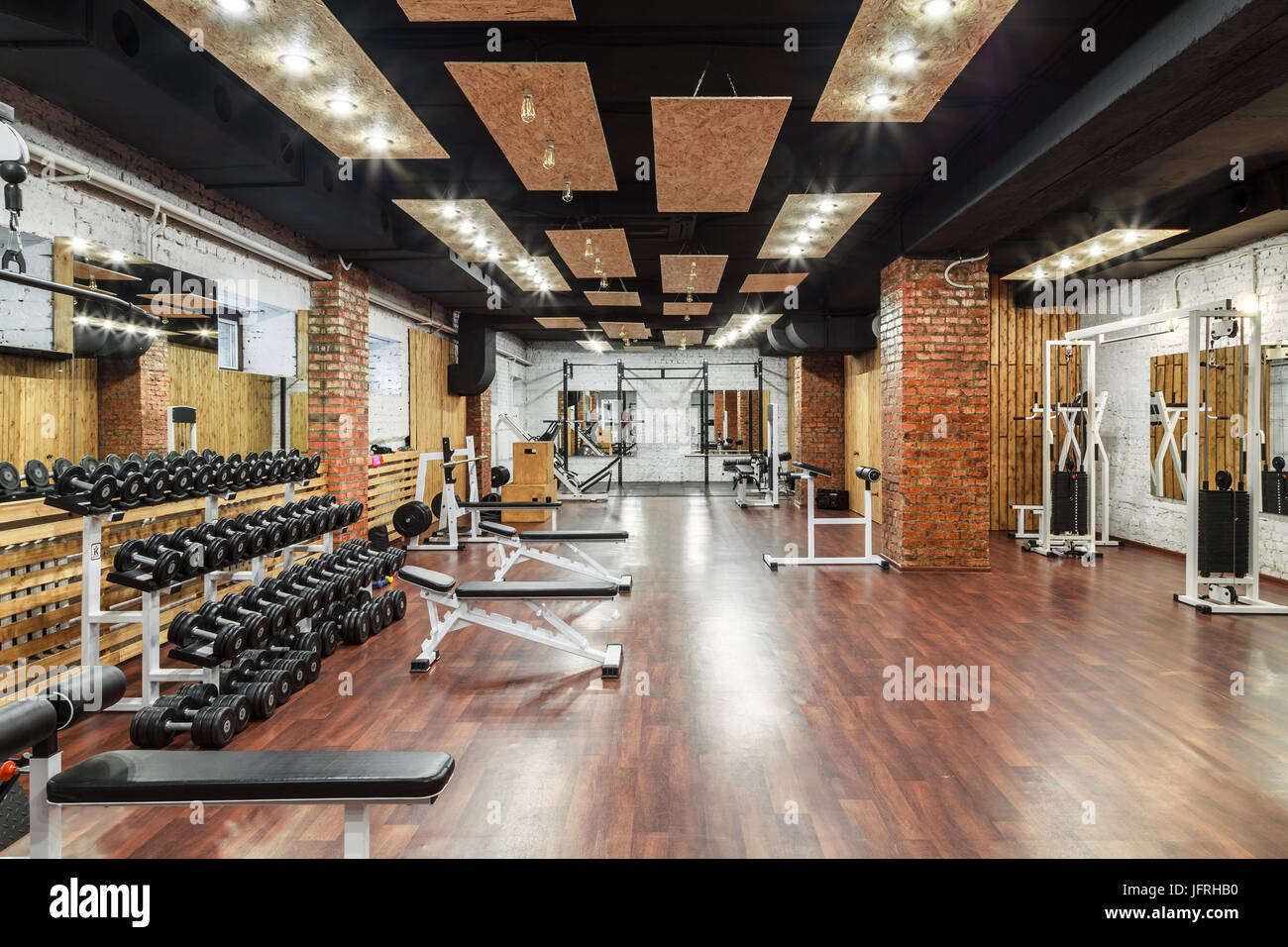 Interior of a gym with equipment at underground style Stock Photo - Alamy